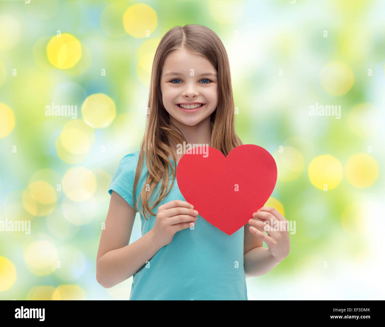 smiling little girl with red heart Stock Photo - Alamy