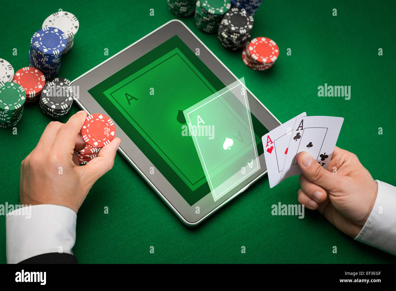casino poker player with cards, tablet and chips Stock Photo - Alamy
