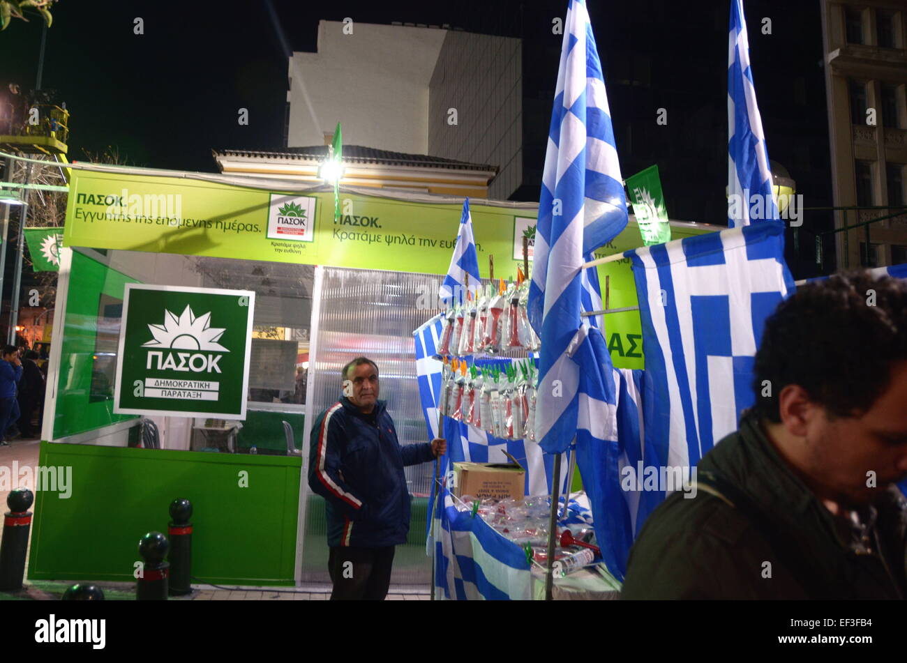 Vendors sell Greek flags in front of the closed election kiosk of PASOK ...