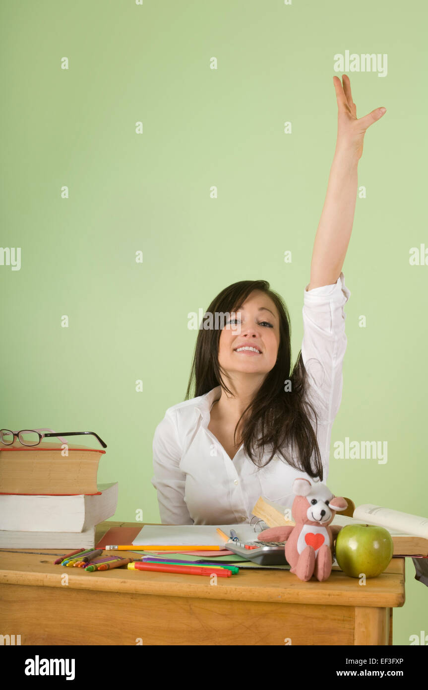 Adult student raising hand Stock Photo - Alamy