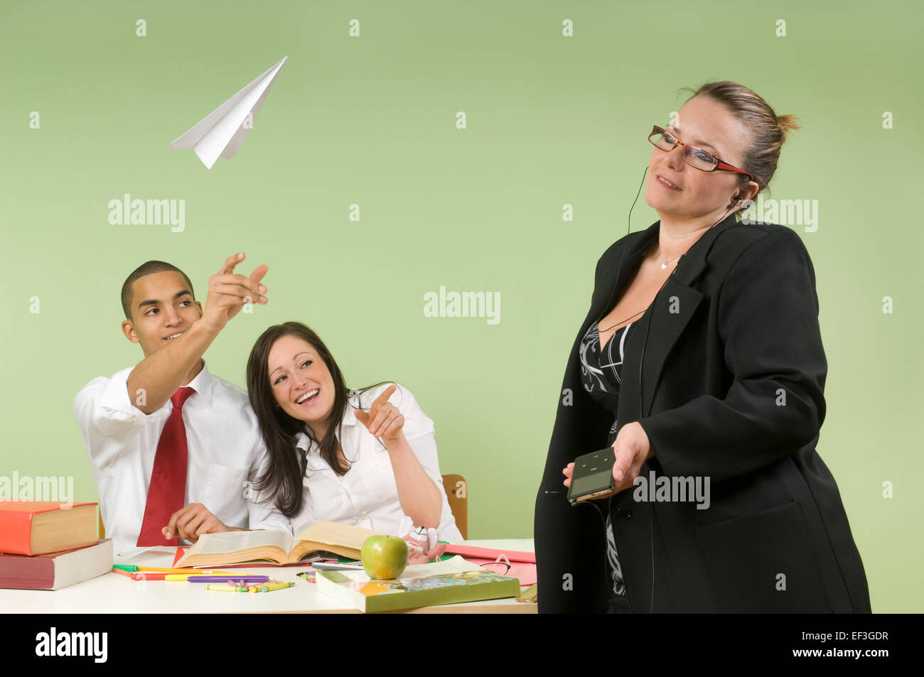 Student throw paper teacher hi-res stock photography and images - Alamy