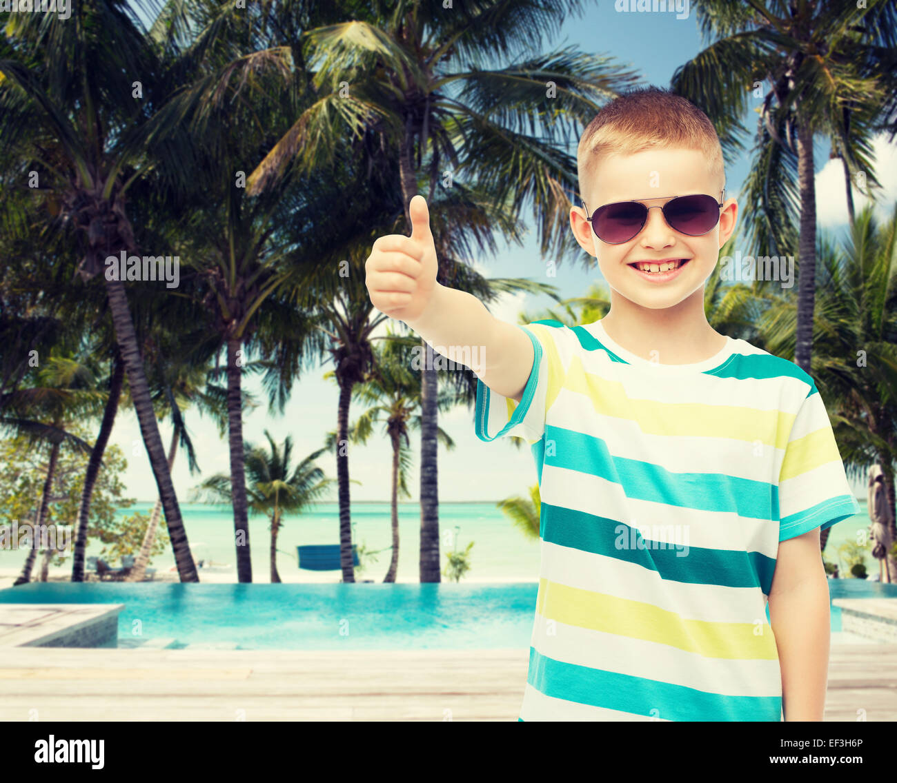 smiling little boy over green background Stock Photo - Alamy