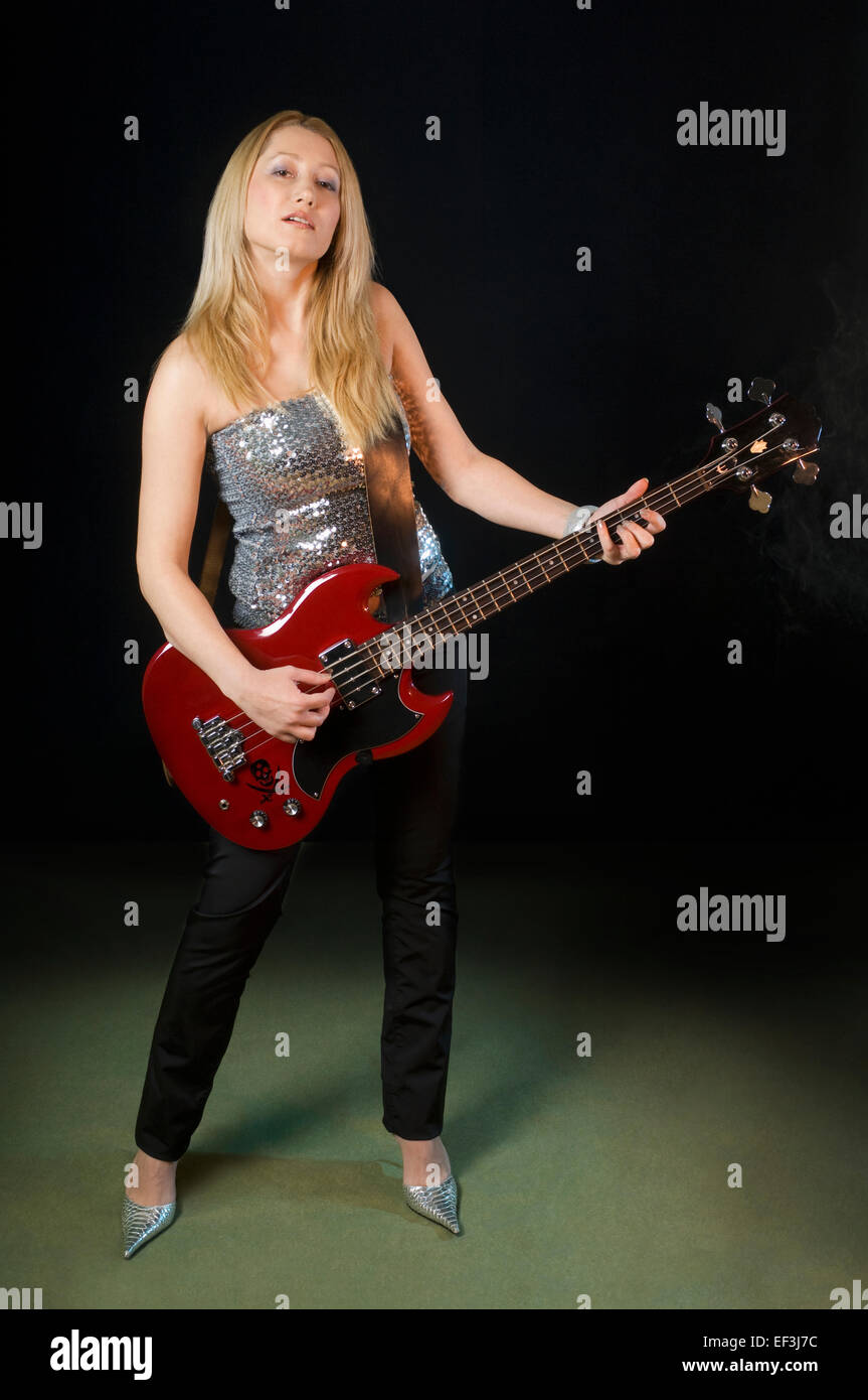 Woman playing guitar Stock Photo - Alamy