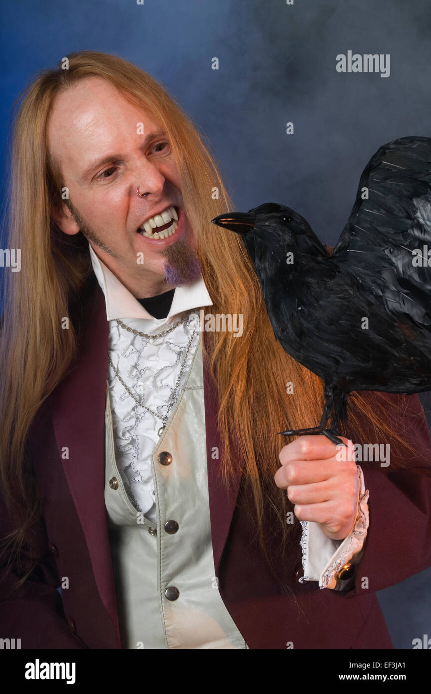 Man holding a raven Stock Photo - Alamy