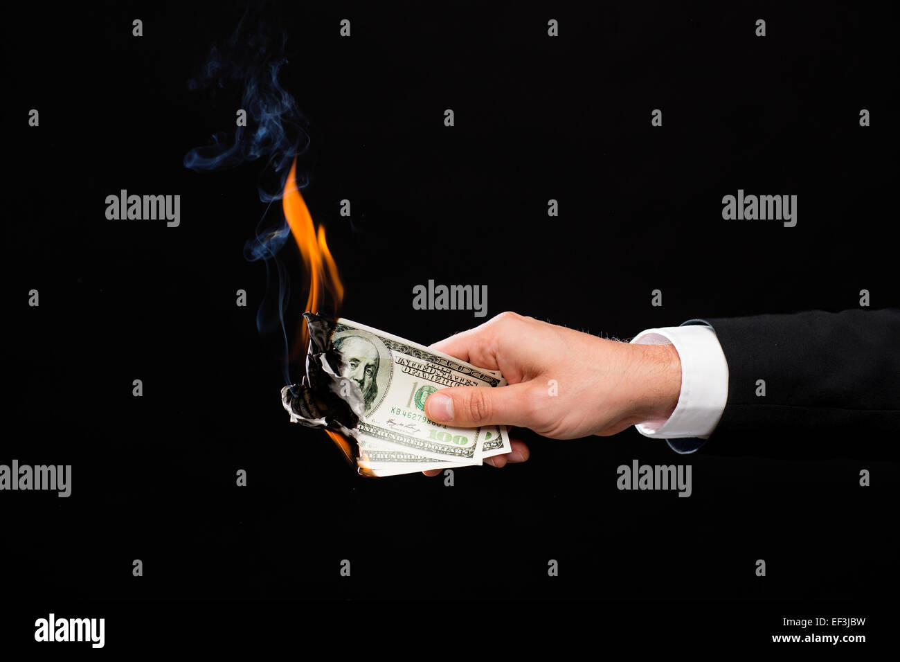 Man burning money hi-res stock photography and images - Alamy