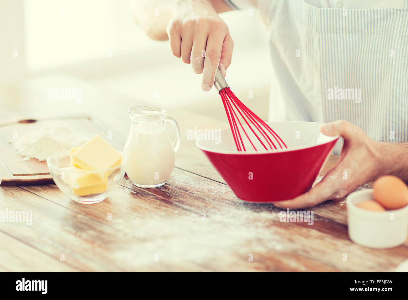 close up of male hand whisking something in a bowl Stock Photo - Alamy