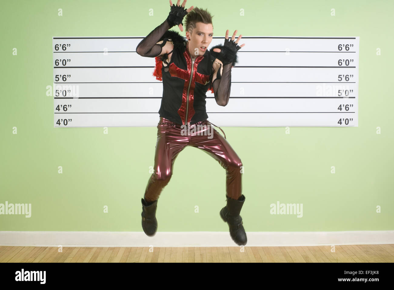 Man wearing a costume and jumping at police department Stock Photo - Alamy