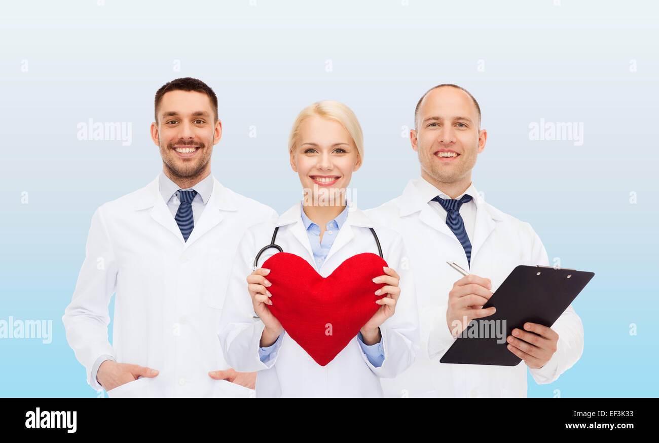group of smiling doctors with heart and clipboard Stock Photo - Alamy