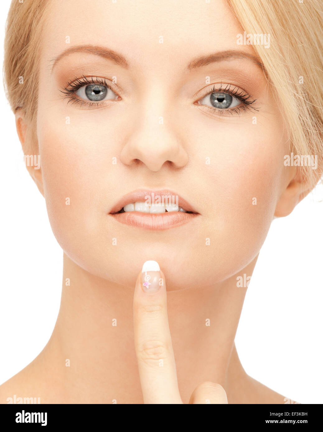 beautiful woman pointing to chin Stock Photo - Alamy