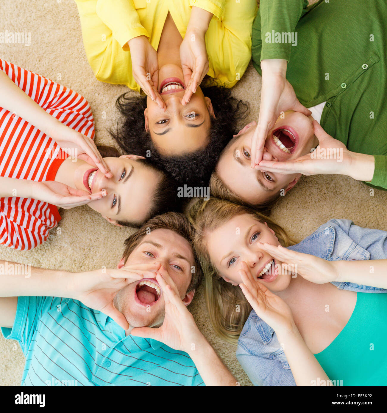 Five people lying on floor hi-res stock photography and images - Alamy