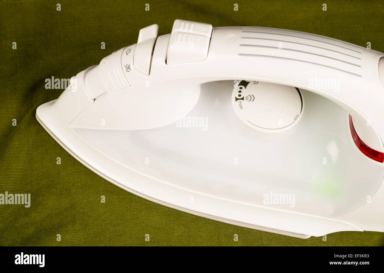 High angle take of an iron on cotton fabric Stock Photo - Alamy