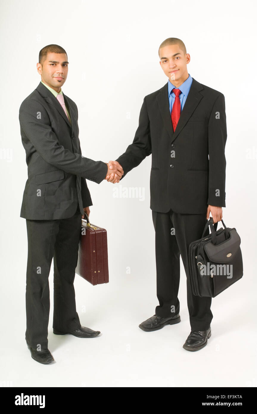 Businessmen shaking hands Stock Photo - Alamy