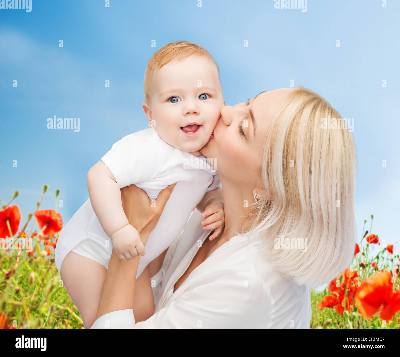 happy mother with baby over natural background Stock Photo - Alamy