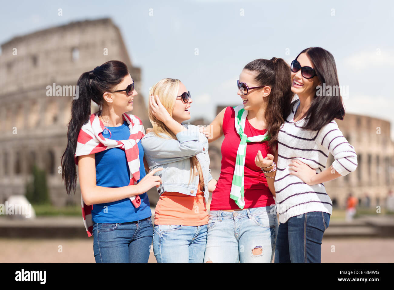 happy teenage girls or young women talking Stock Photo - Alamy