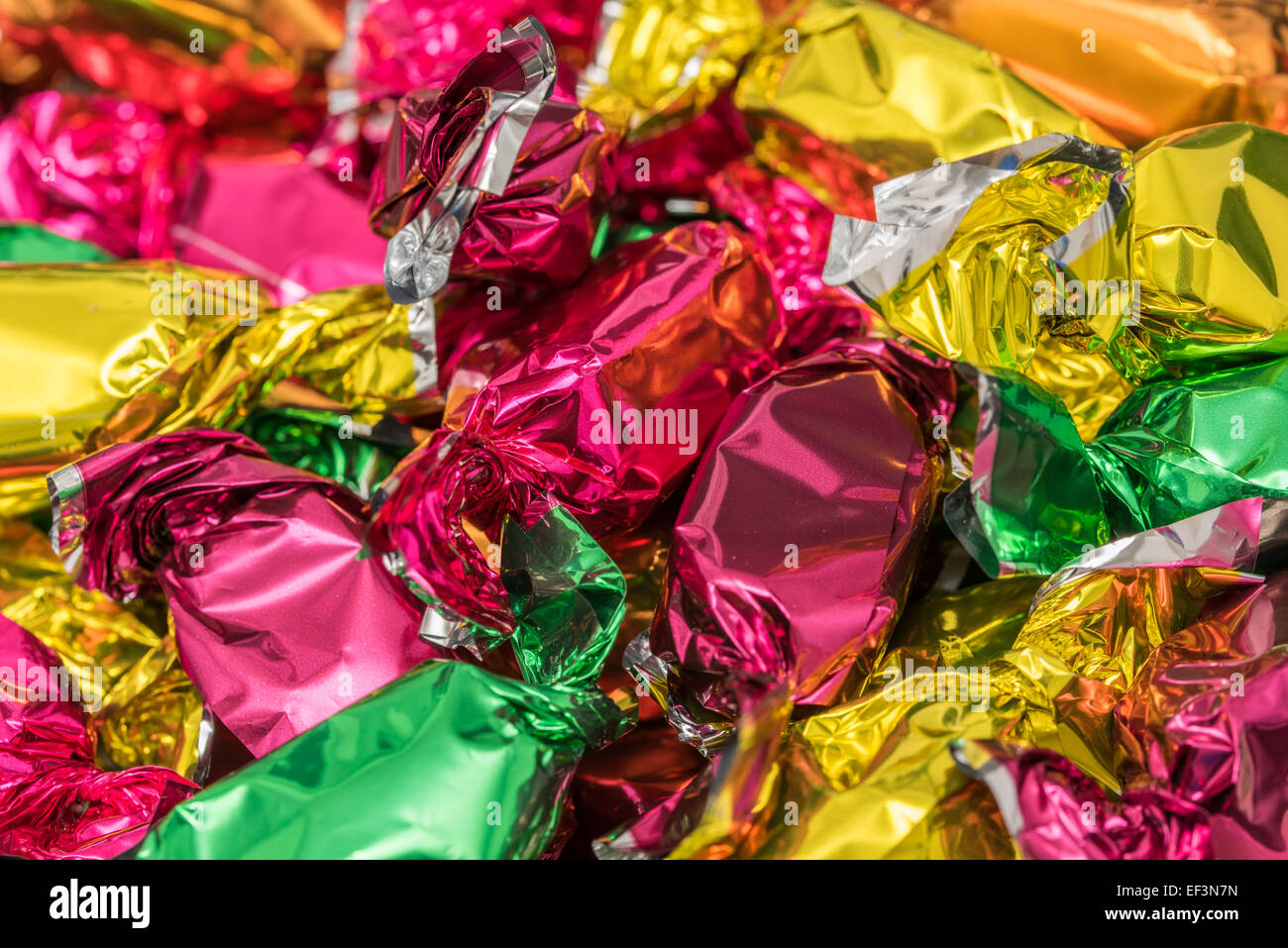 Yellow wrapped candy hi-res stock photography and images - Alamy