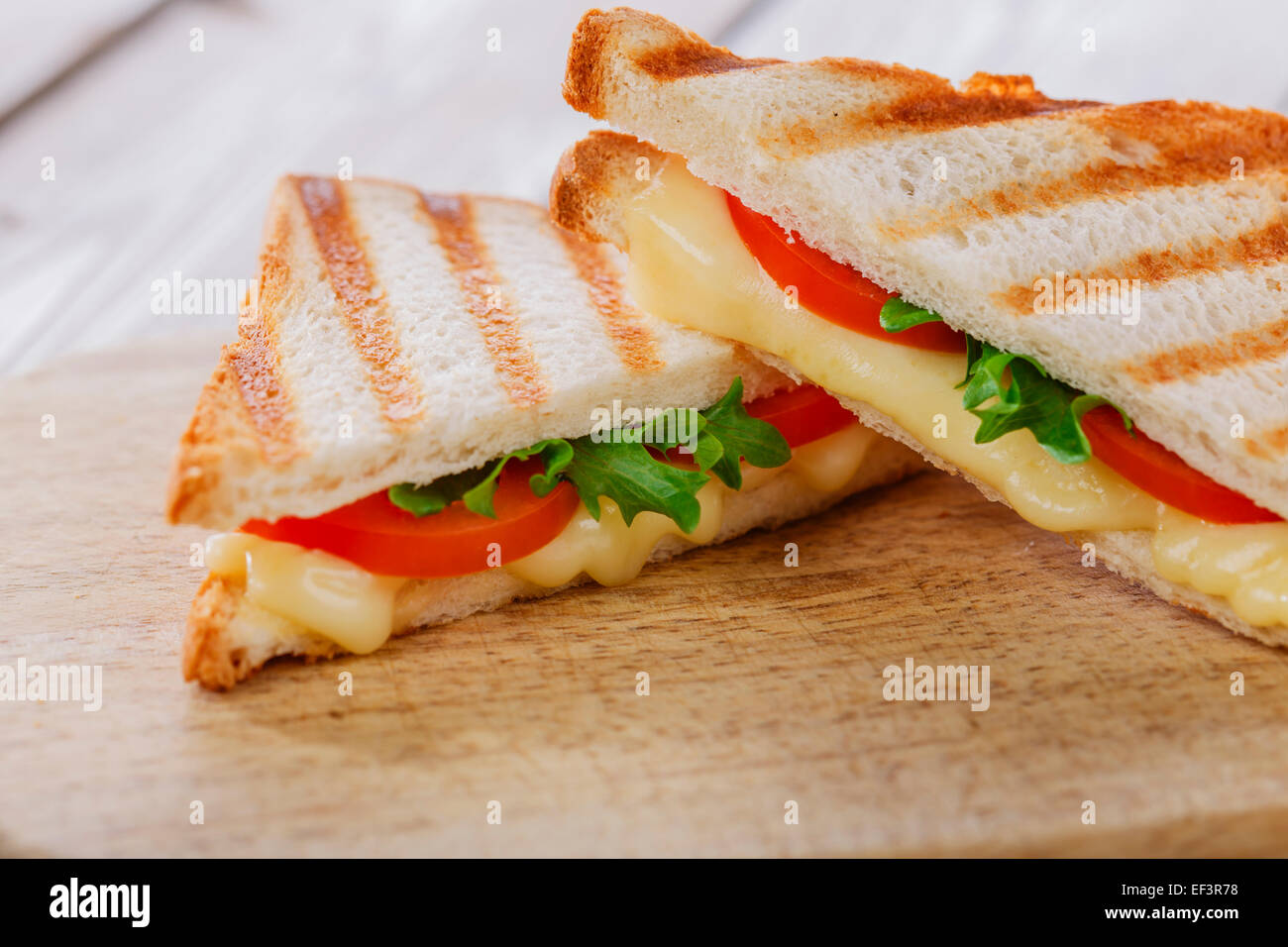sandwich toast grilled with cheese and tomatoes Stock Photo - Alamy