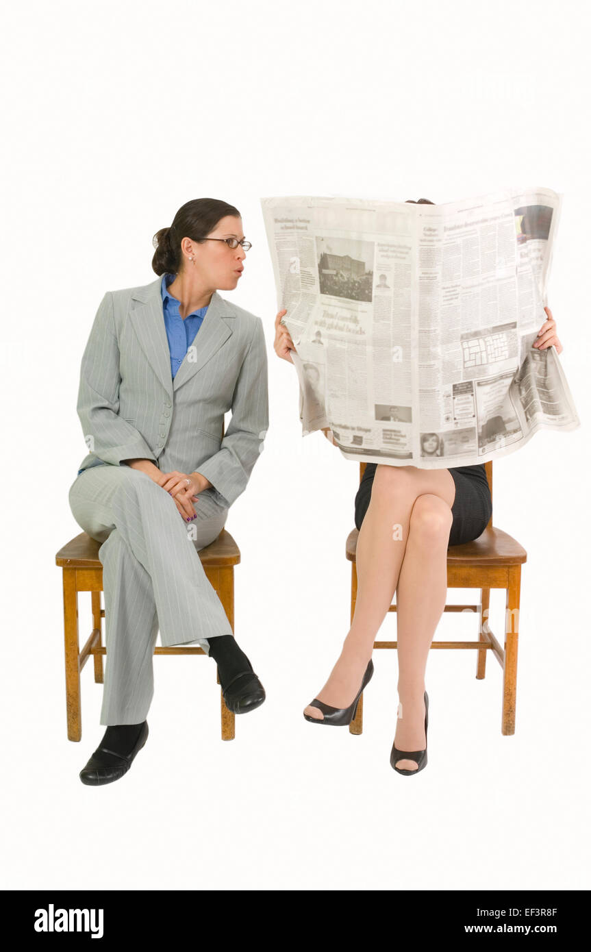 Woman reading newspaper sitting Cut Out Stock Images & Pictures - Alamy