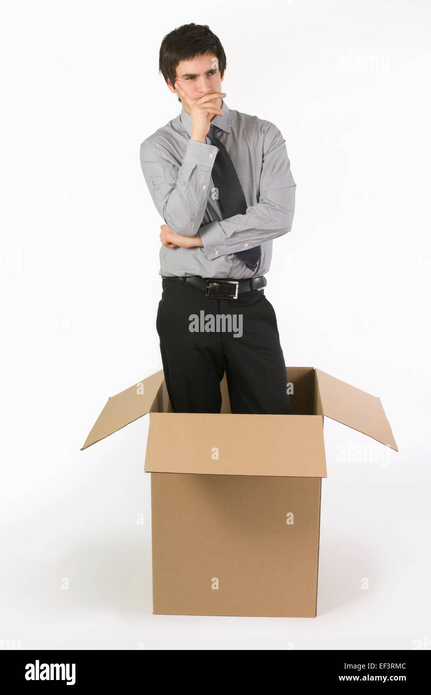 Man thinking standing boxes hi-res stock photography and images - Alamy