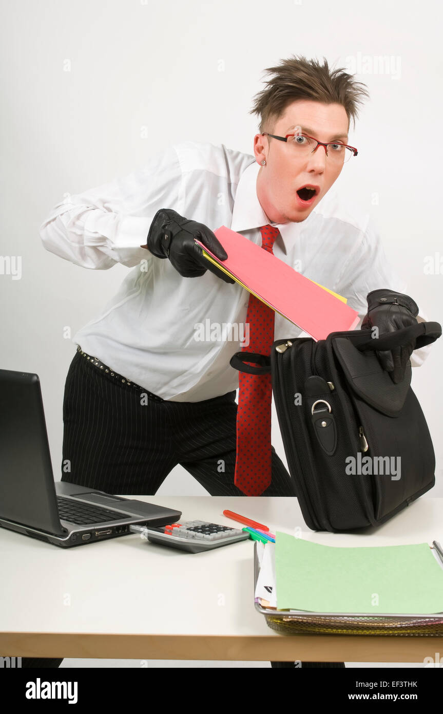 Man stealing a file folder Stock Photo - Alamy