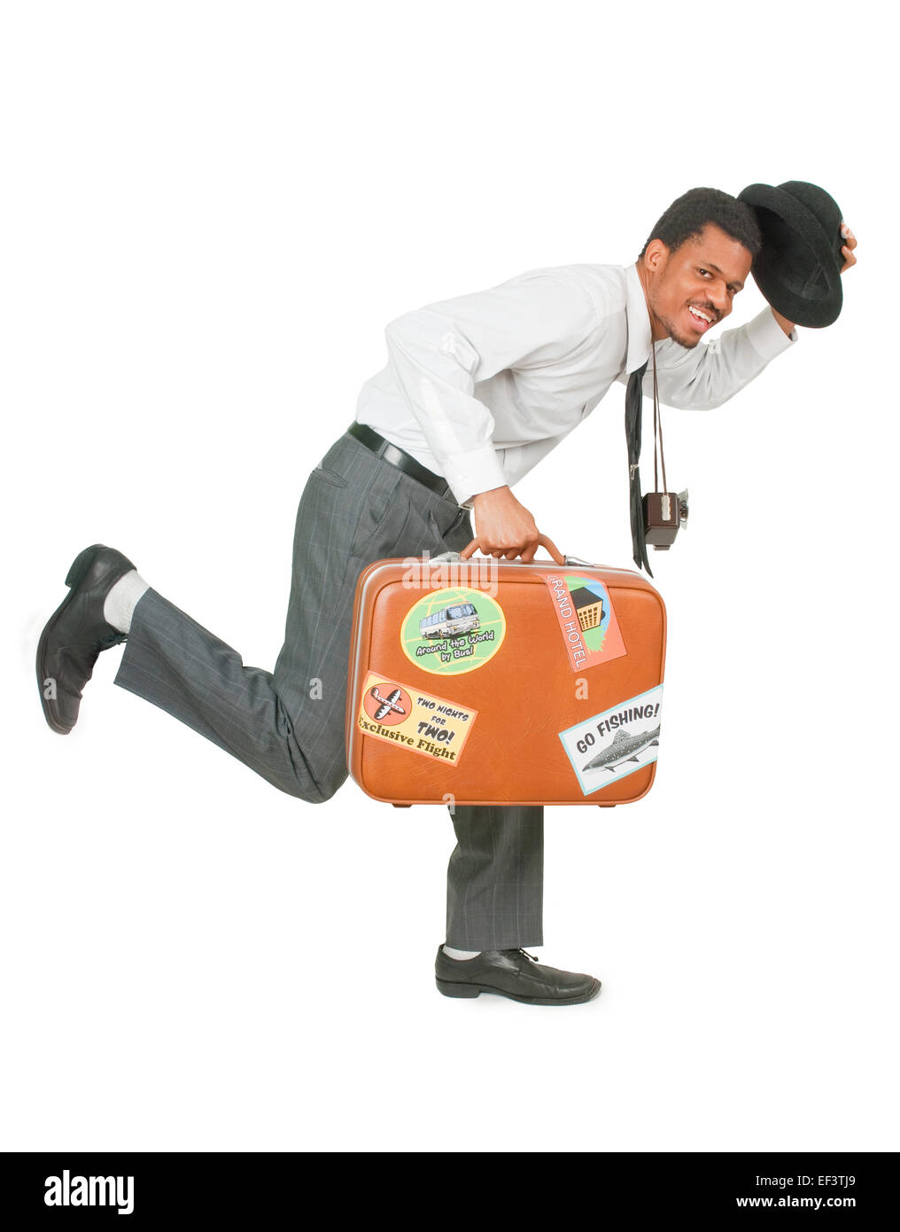 Man running with suitcase in his hand Stock Photo - Alamy