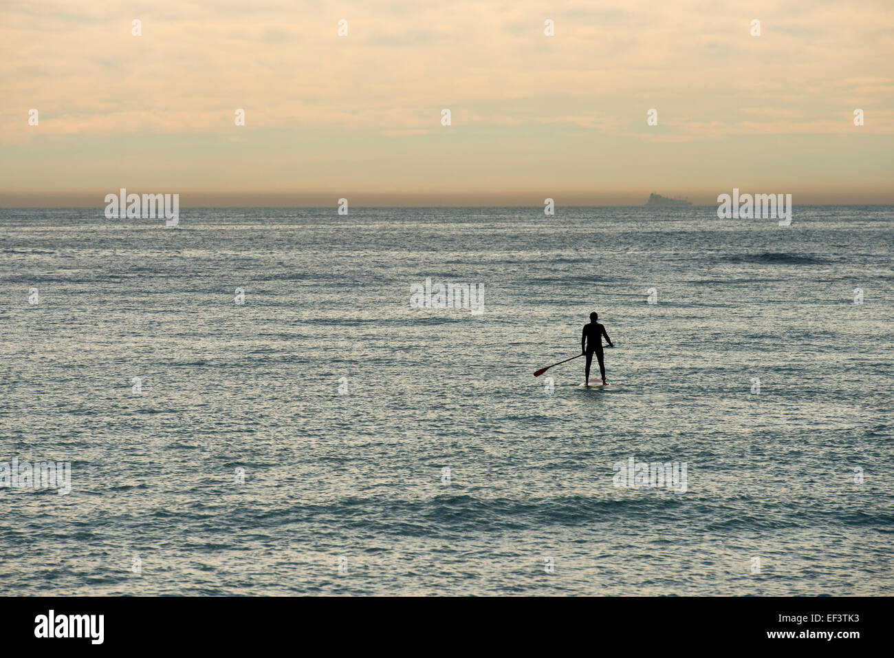 Paddle surf on the beach Stock Photo - Alamy