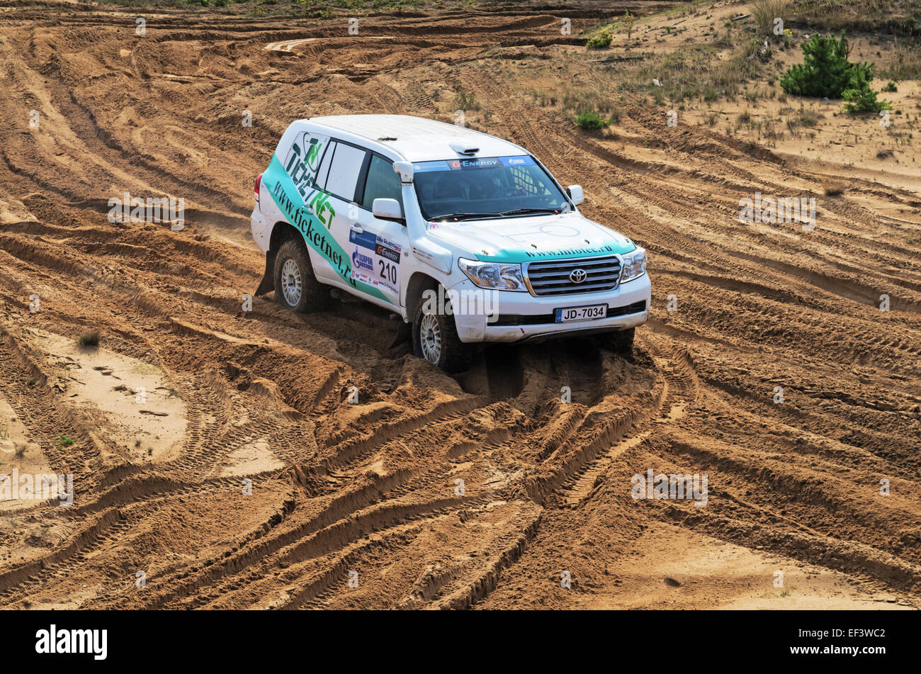 Races on a rally-raid on sandy dunes. Rally-raid Baha "Belarus" 2014 ...