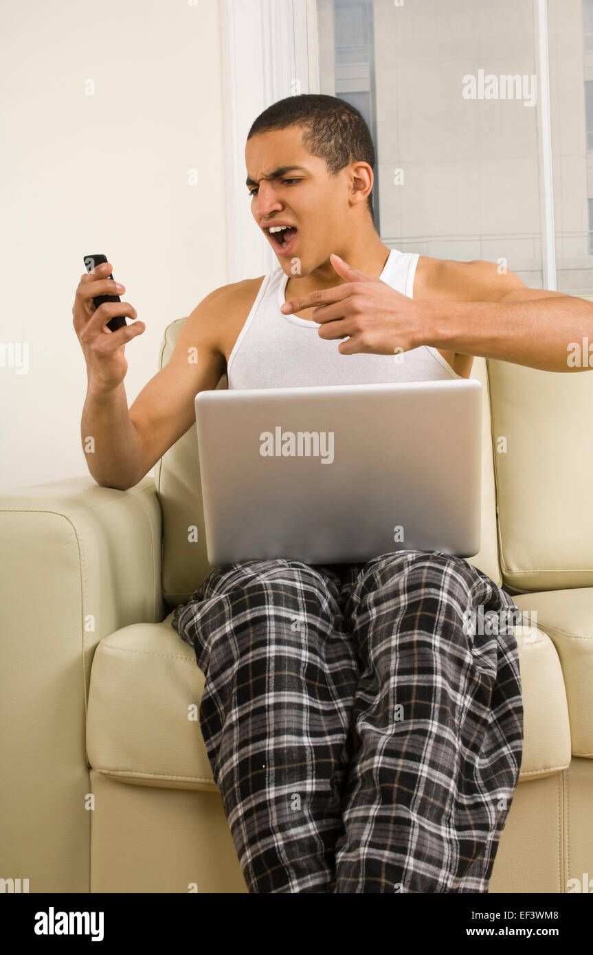 Angry man yelling into phone Stock Photo - Alamy