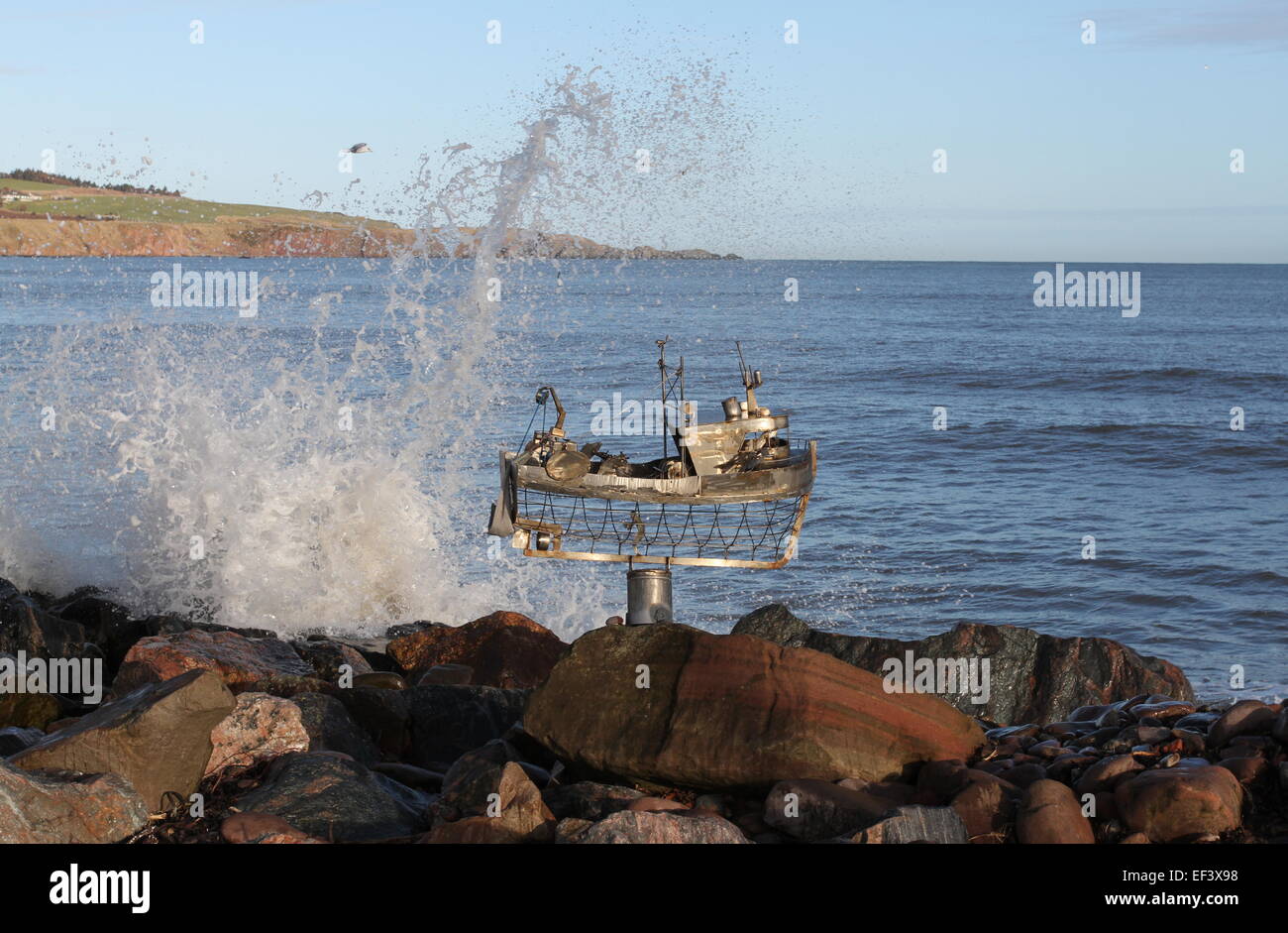 Fishing boat sculpture and breaking wave Stonehaven Scotland January ...