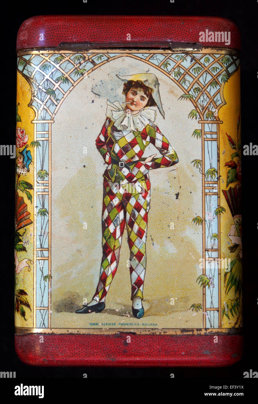A cigarette tin featuring images of jesters, with a detailed ...