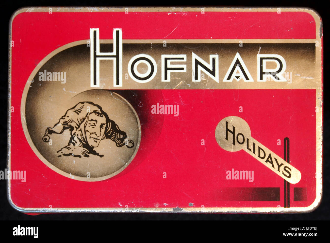 A red cigar tin labeled 'Hofnar Holidays' displaying vintage cigar ...