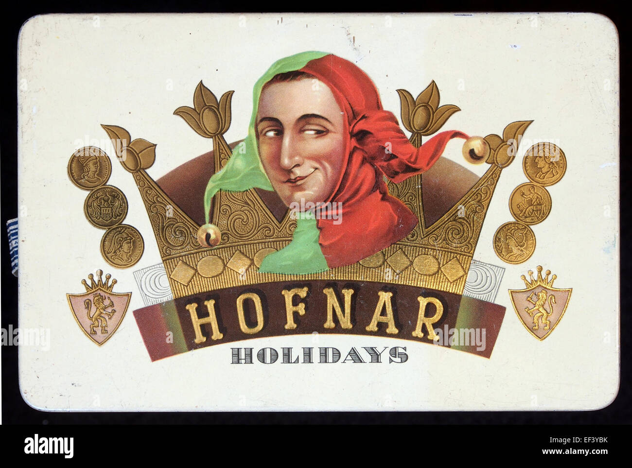 This image features a white tin container for Hofnar Holidays cigars, a ...