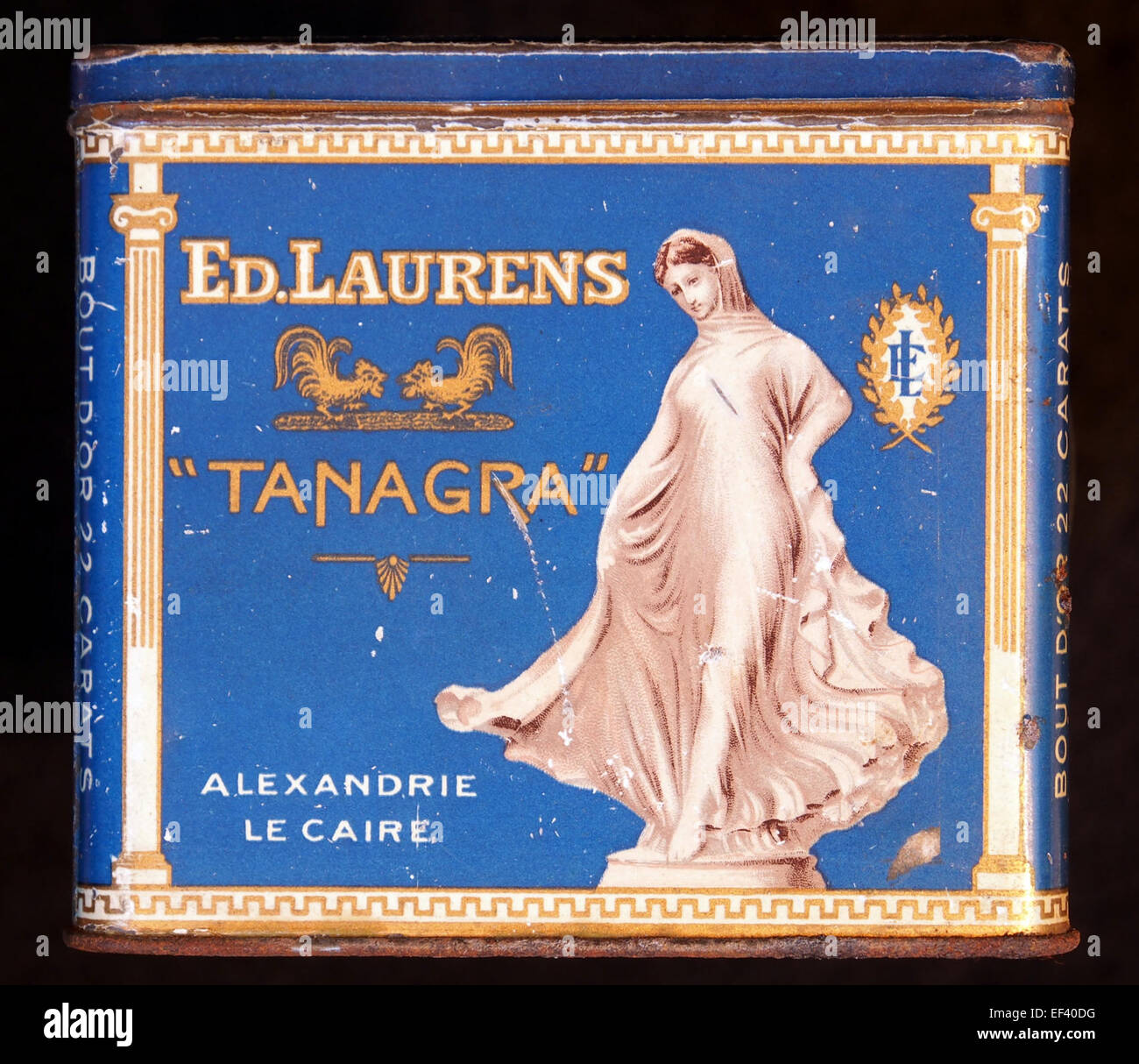 The Tanagra cigarettes tin features a detailed design with side ...