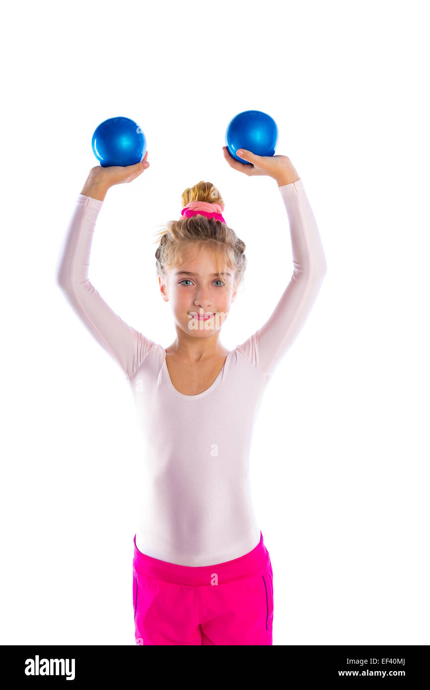 blond fitness kid girls exercise workout with sand balls on white Stock ...