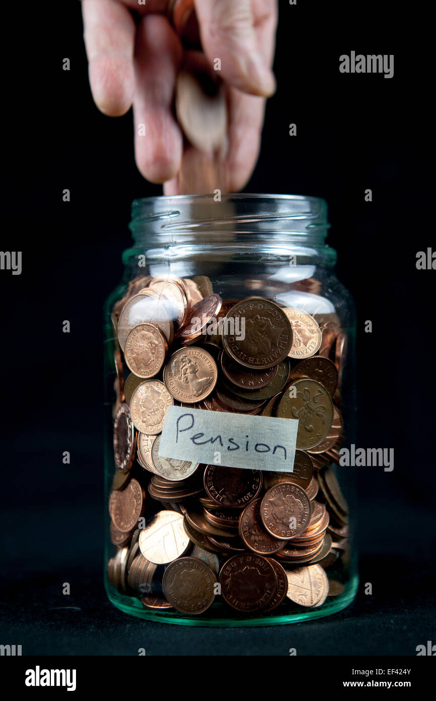 Adding some pennies to a pension pot Stock Photo - Alamy