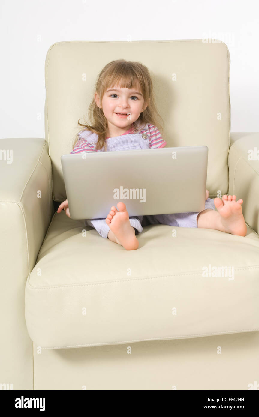 Young girl holding laptop Stock Photo - Alamy