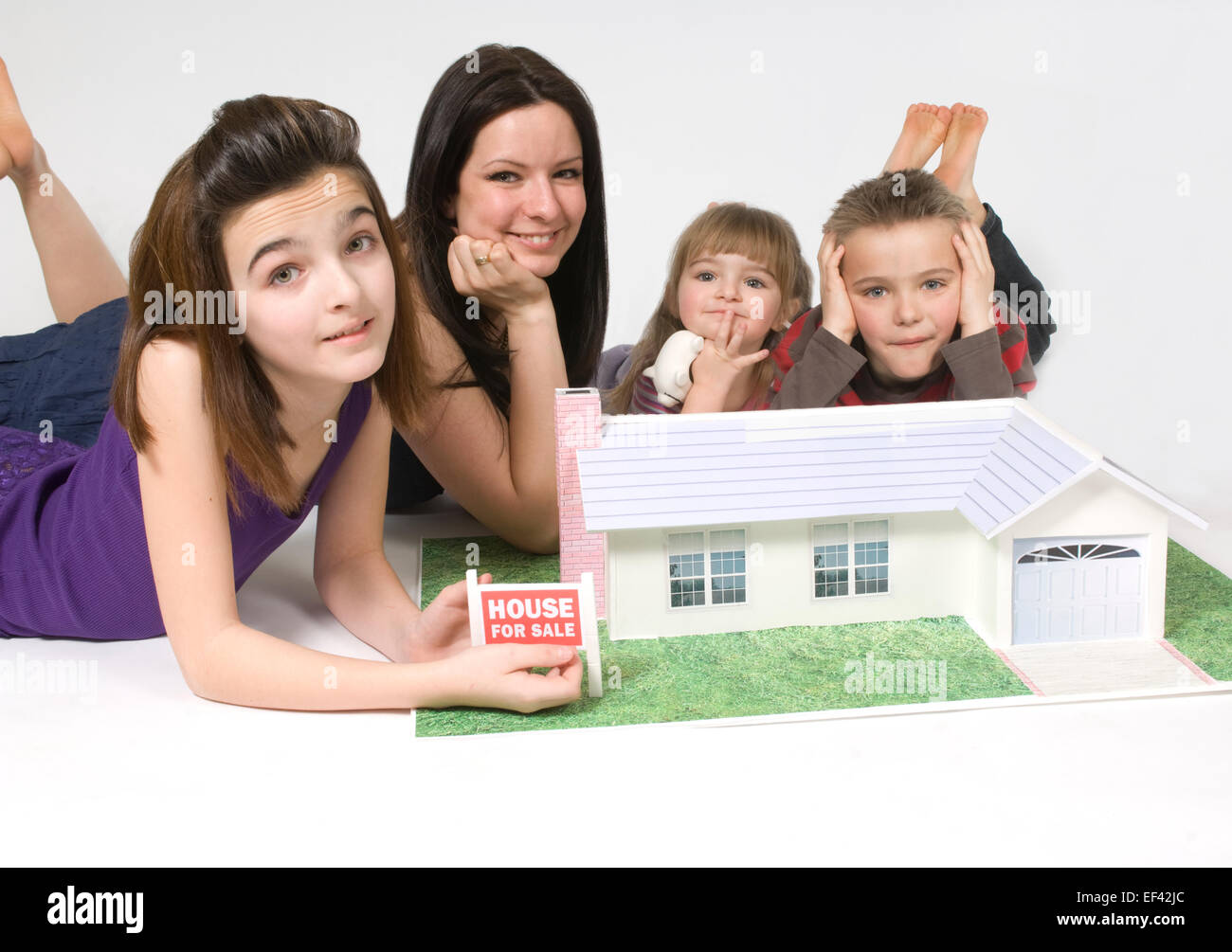Family looking at model home Stock Photo - Alamy