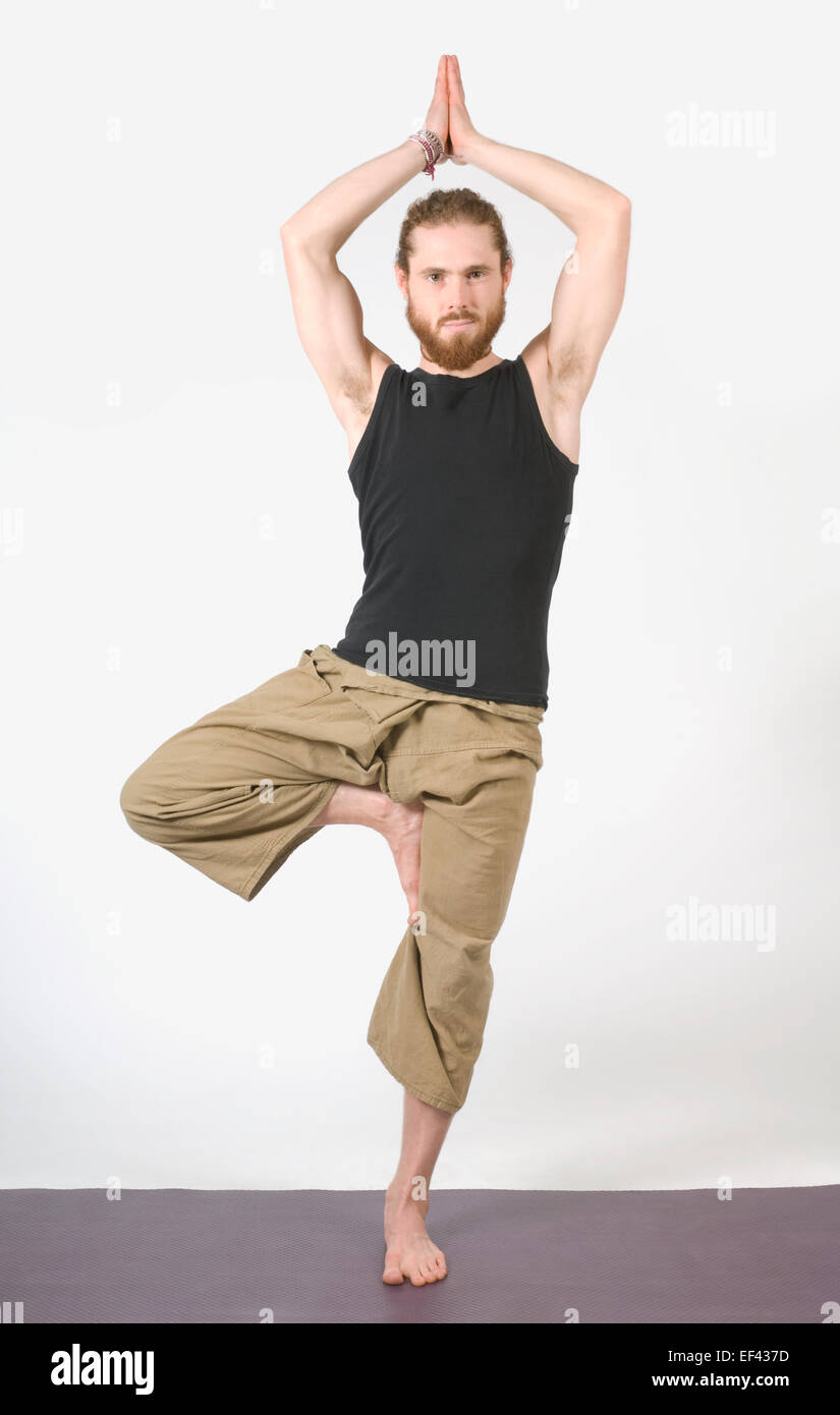 Man doing yoga Stock Photo - Alamy