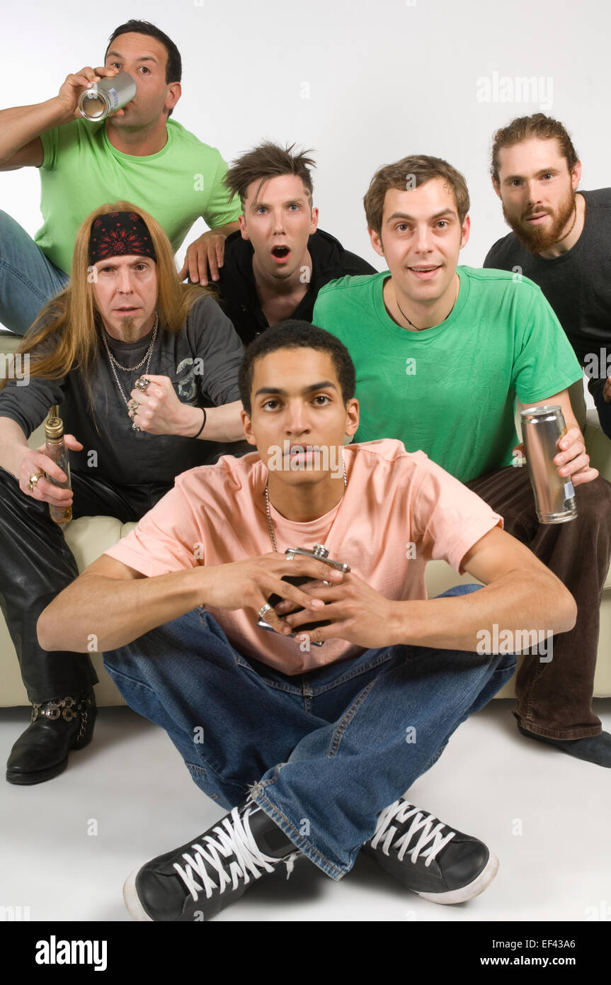 Group of people watching television Stock Photo - Alamy