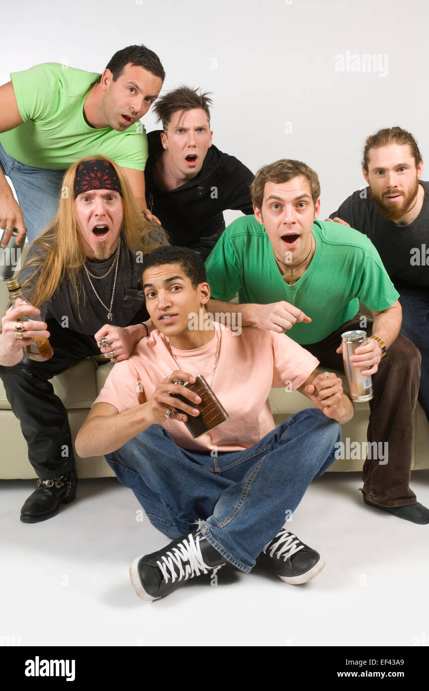 Group of people watching television Stock Photo - Alamy