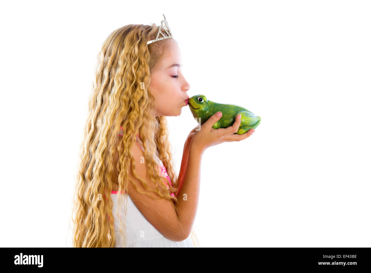 blond princess girl kissing a frog green toad like a story tale on ...