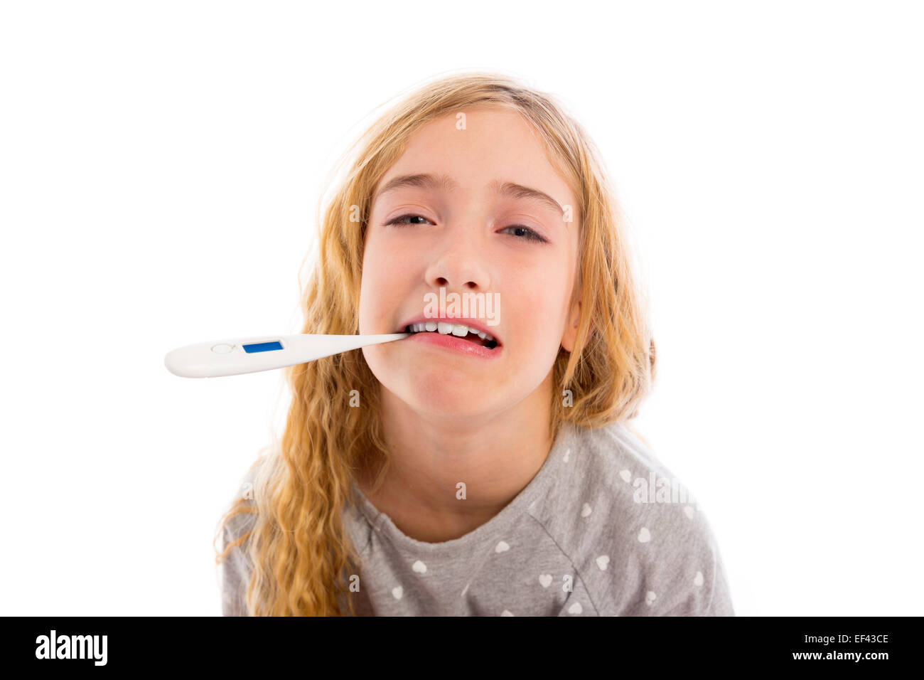 blond girl with thermometer and flu cold in pyjama and funny face Stock ...