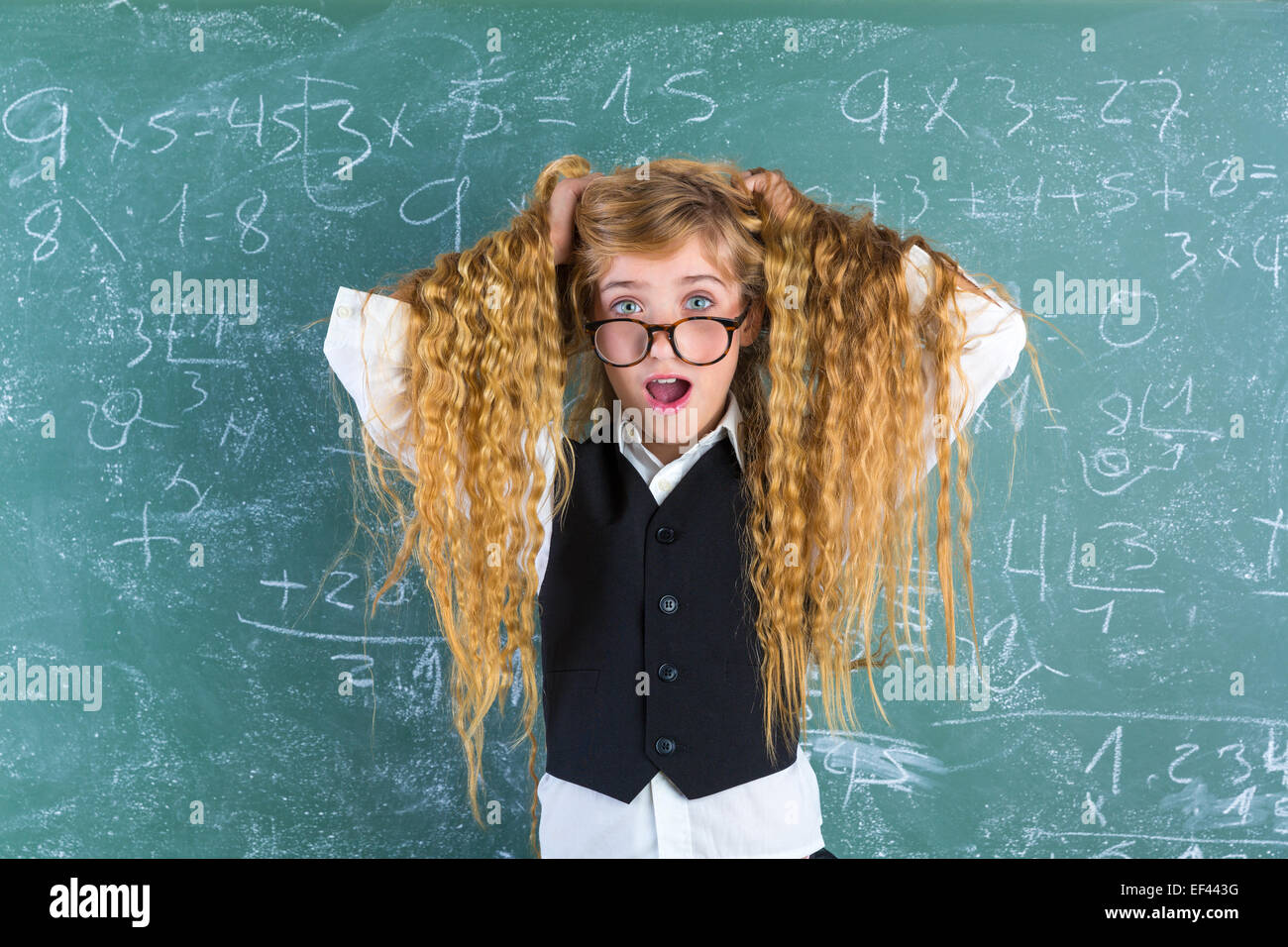 Crazy nerd blond student girl holding hair surprised expression in ...