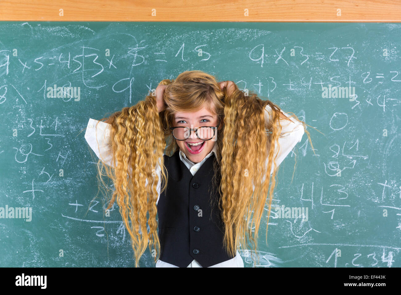 Crazy nerd blond student girl holding hair surprised expression in ...