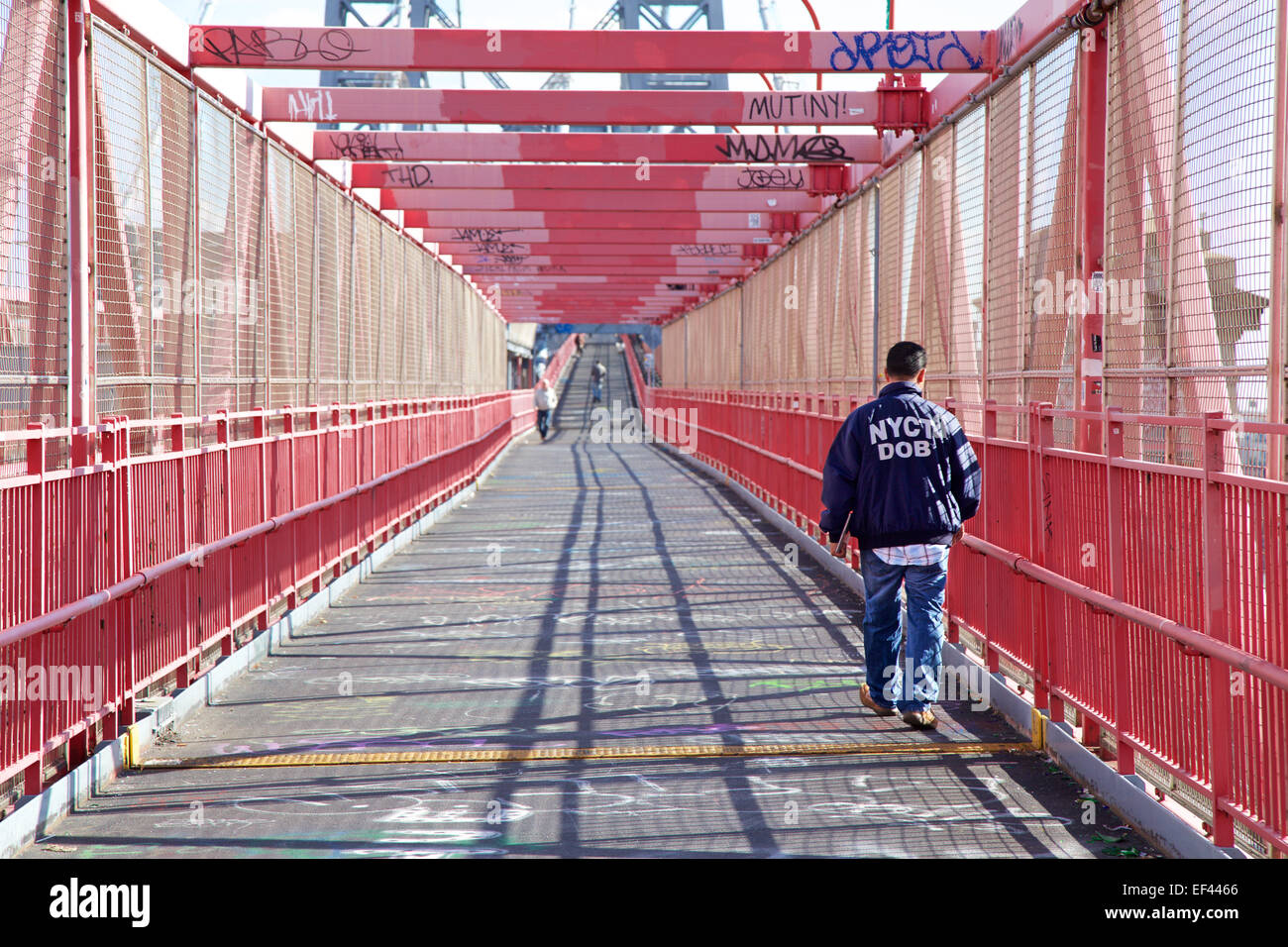 On the Williamsburg Bridge pedestrian walkway in New York, NY, USA ...