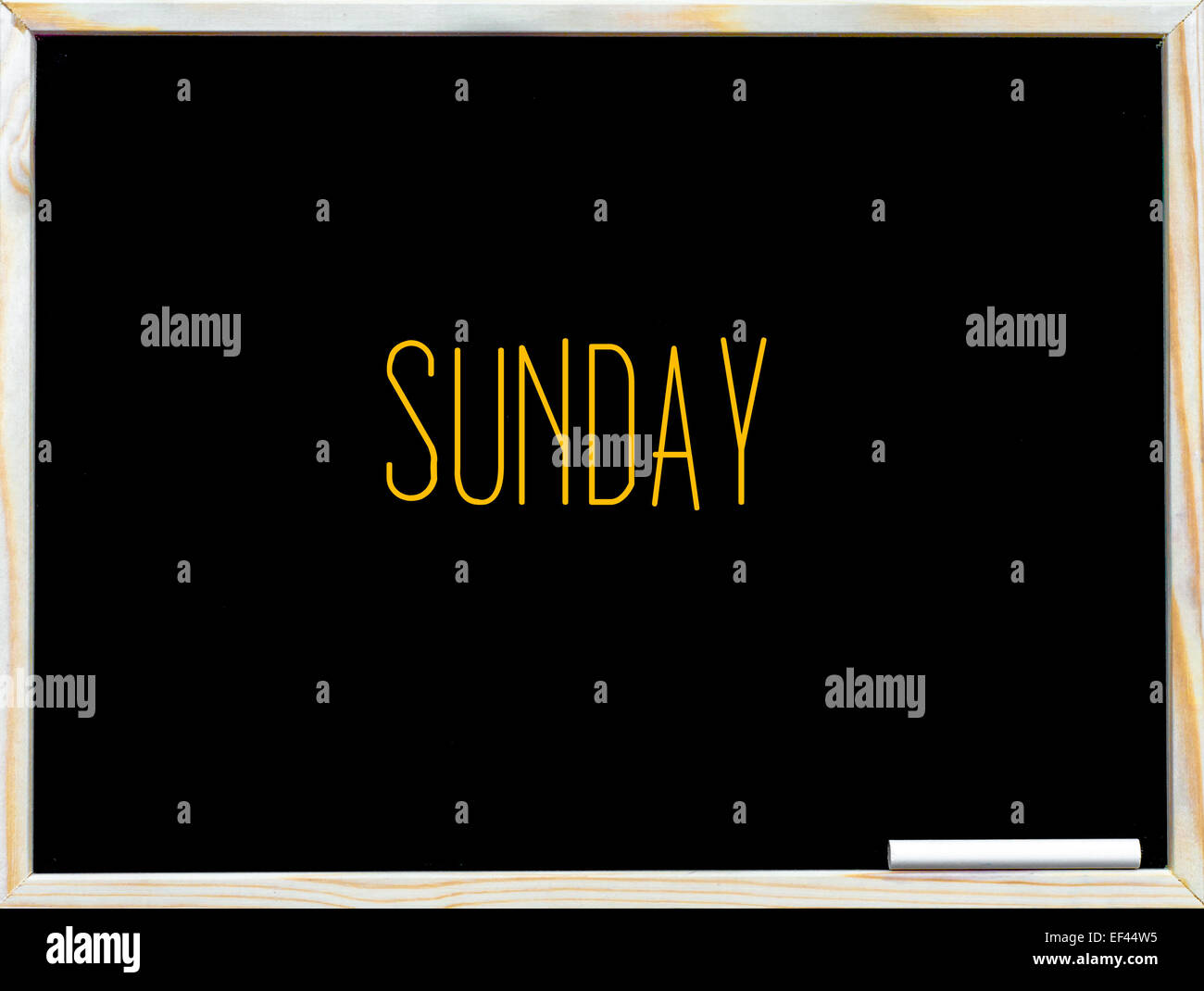 Sunday, vintage chalk text on blackboard, white piece of chalk in the ...