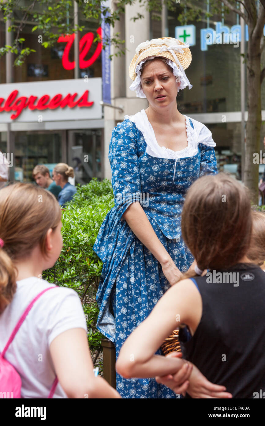 Tour guide dressed in traditional costume talking to children, Freedom ...