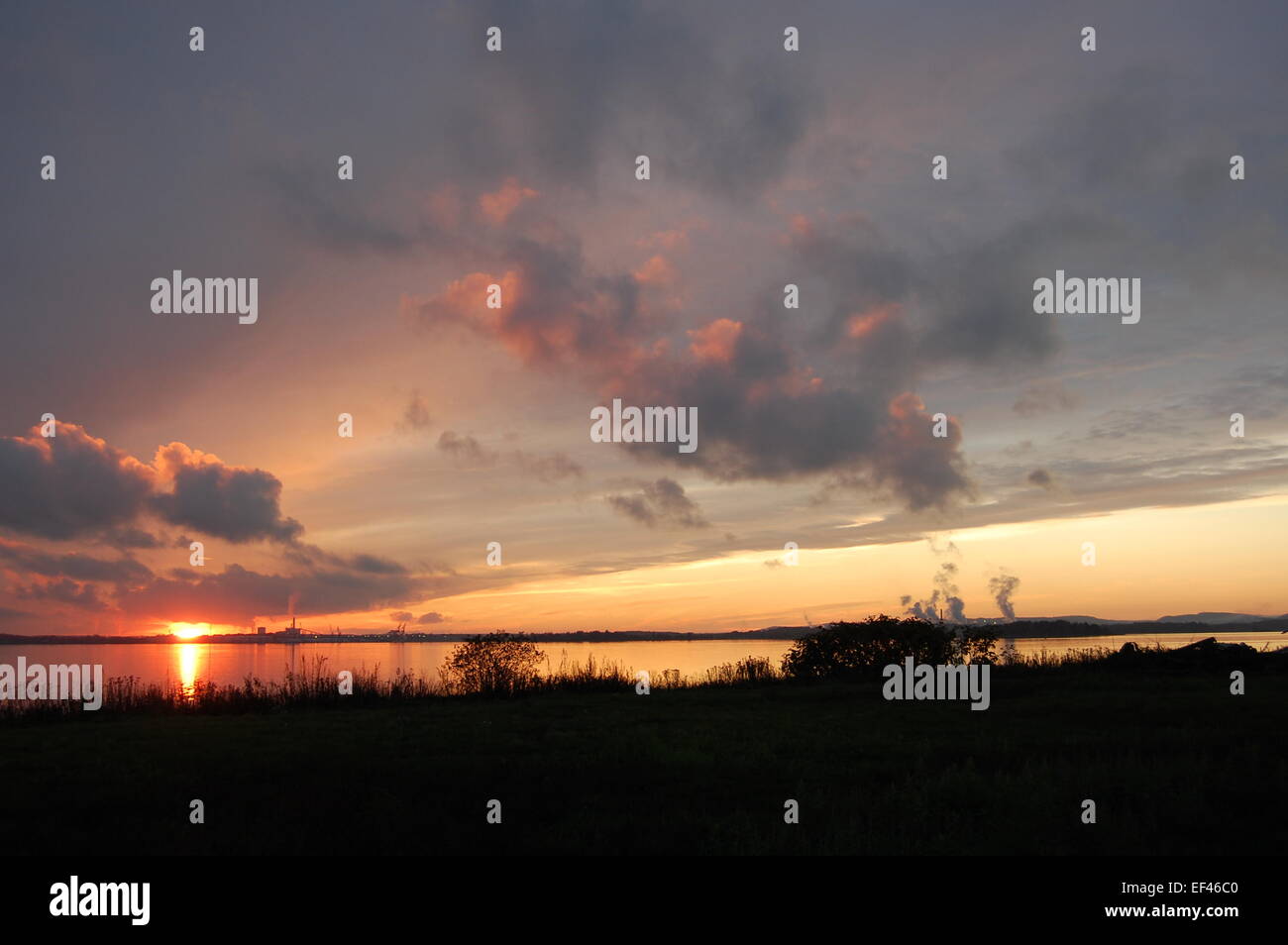 Smokes and clouds in sunset, Animal Island (Djurön), Sweden Stock Photo ...