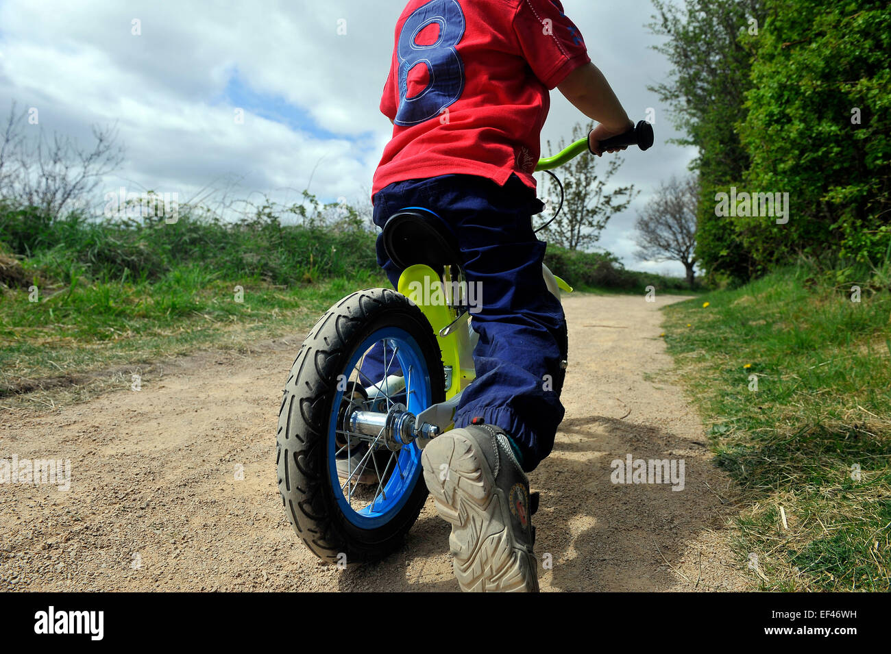 Boy riding his bicycle hi-res stock photography and images - Alamy