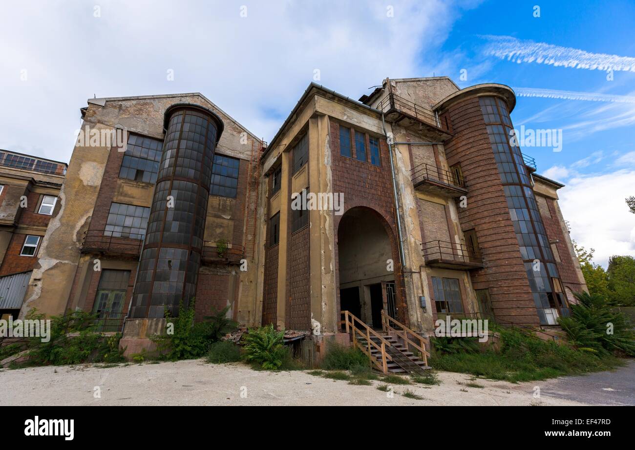 Old factory against blue sky Stock Photo - Alamy