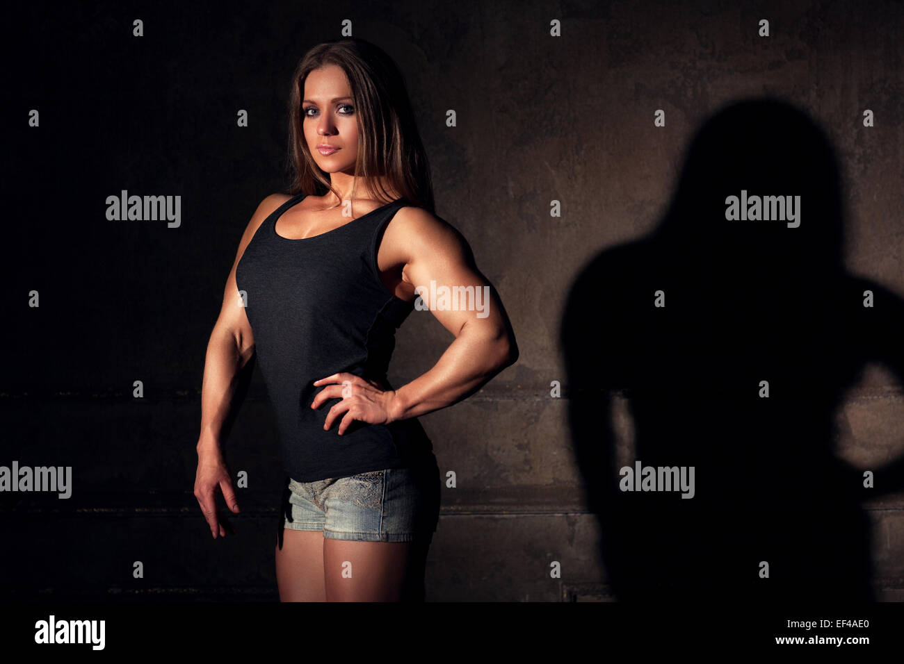 Young strong woman bodybuilder Stock Photo - Alamy